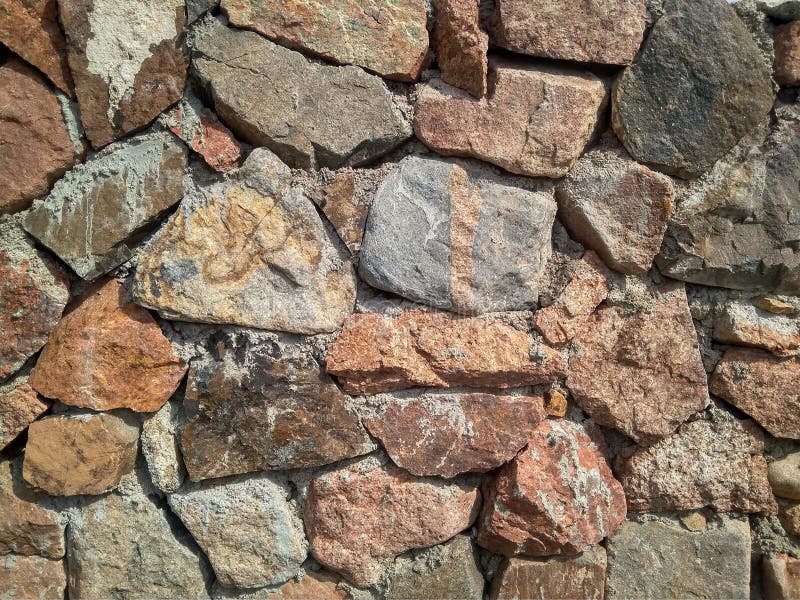 A Wall Made of Natural Stone with Complex Shapes and Different Sizes ...