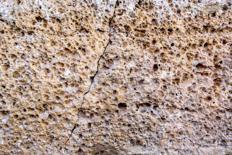 The Wall is Made of a Porous Surface of Sandstone Stone Stock Image ...