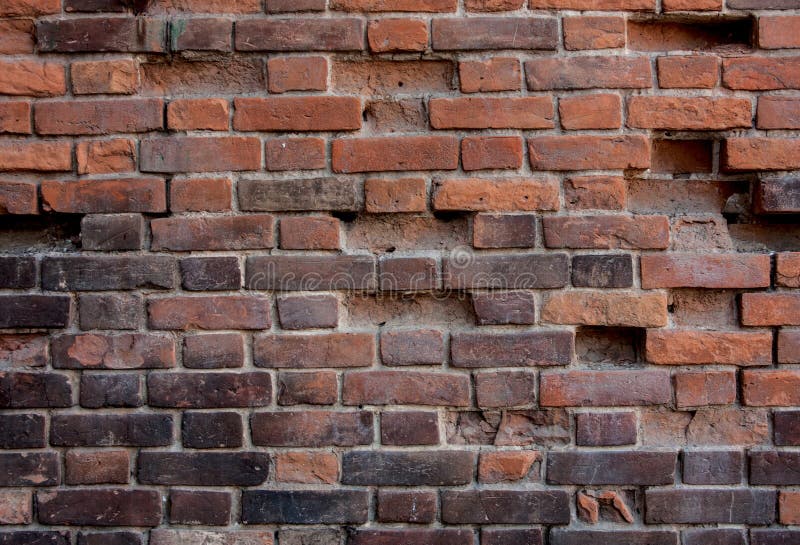 The Wall is Made of Red Brick with Traces of Burning. Stock Photo ...