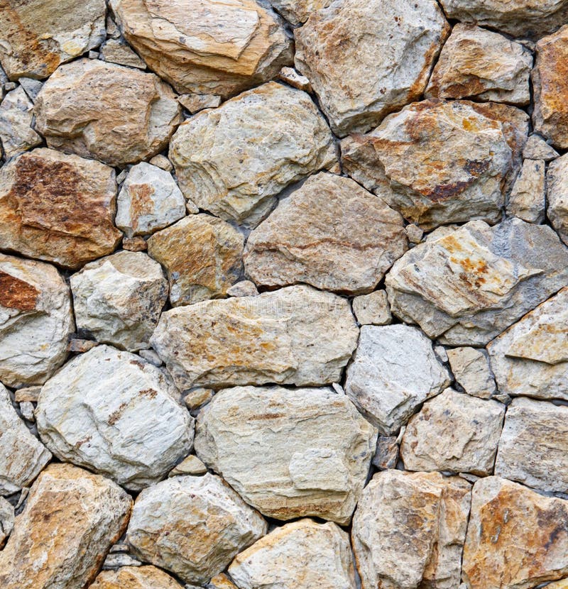 A Wall Made of Rocks with a Rough Texture Stock Photo - Image of ...