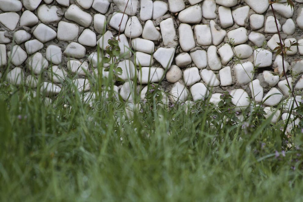 Wall Made Using White, Rounded White Stones. Stock Photo - Image of ...