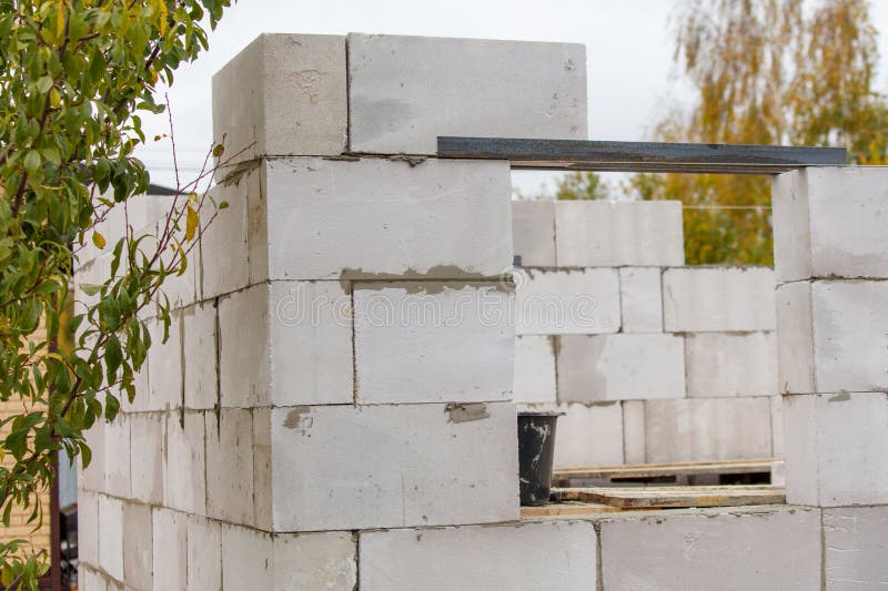 A Wall Made of White Bricks with a Black Metal Rod Sticking Out of it ...