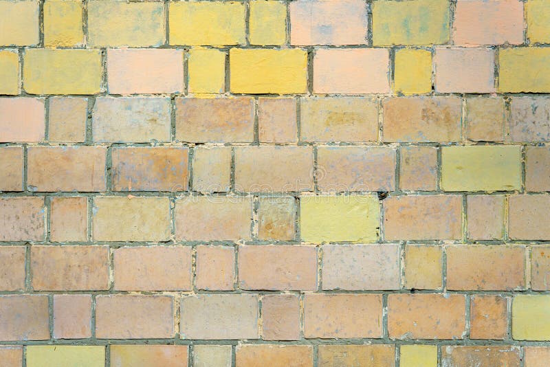 A Wall Made of Yellow and Pink Bricks. Stock Photo - Image of sidewalk ...