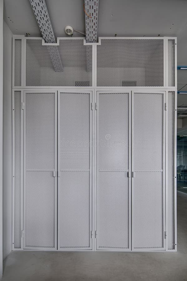 Wall with mesh doors stock image. Image of mesh, work - 80168927