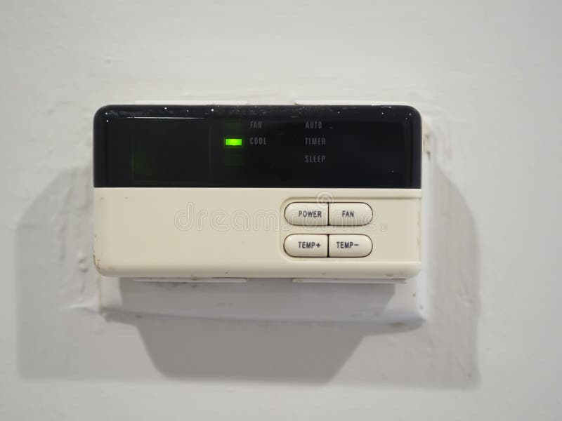 Wall Mounted Air Conditioner Remote Control on a White Cement Wall ...