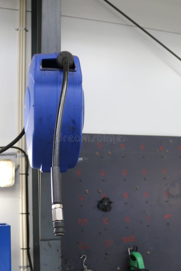 Wall Mounted Compressed Air Hose Reel Pneumatic. Stock Photo - Image of ...