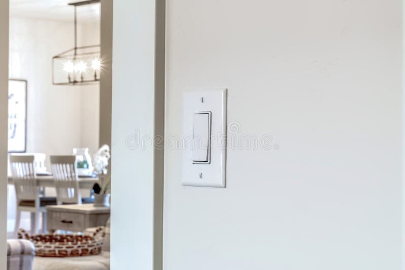 Wall Mounted Electrical Rocker Light Switch with Blurry Dining Room ...
