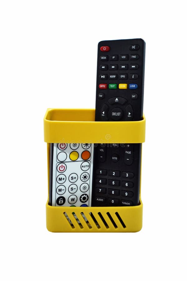 Wall Mounted Plastic Organizer with Remote Controls in it Stock Image ...