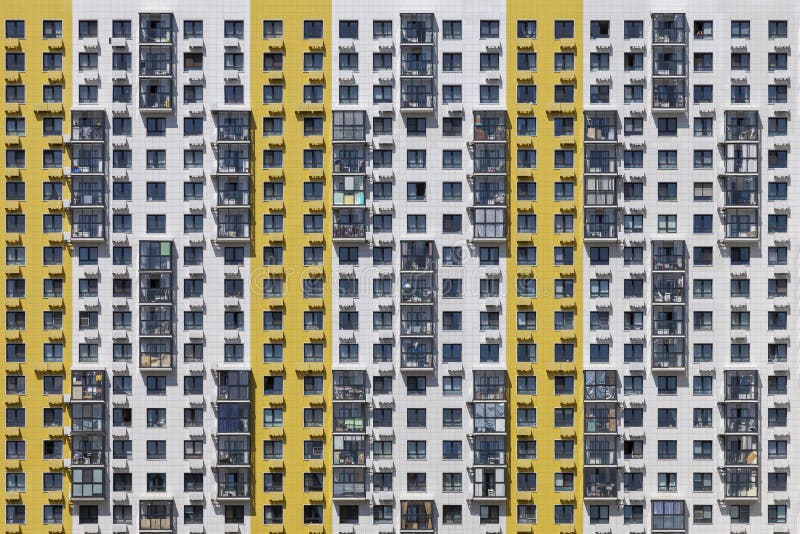 The Wall of a New High-rise Building in White and Yellow with the Same ...