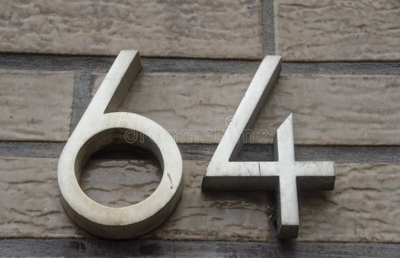 A Wall with the Number Sixty-four Stock Photo - Image of bumper ...