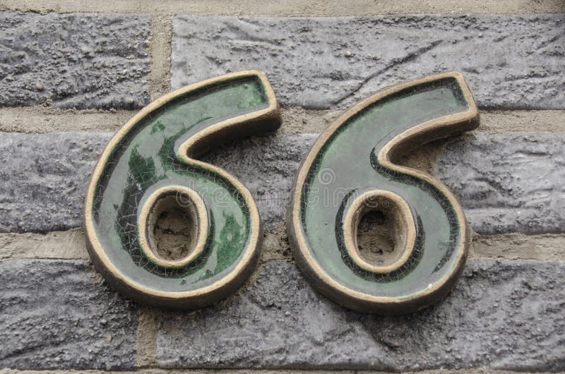 A Wall with the Number Sixty-six Stock Image - Image of green, tire ...