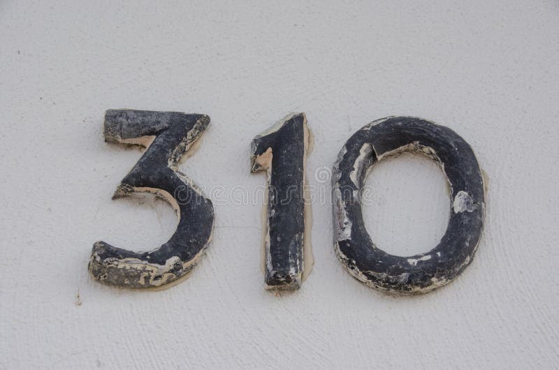 Wall with the Number Three Hundred Ten Stock Photo - Image of address ...
