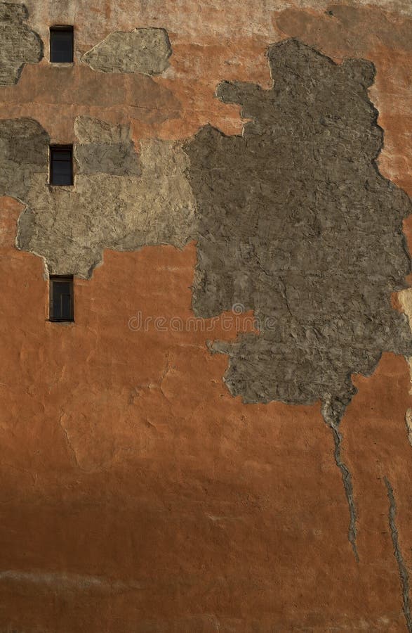 The Wall of an Old Brick Building with Fallen Plaster and Three Windows ...