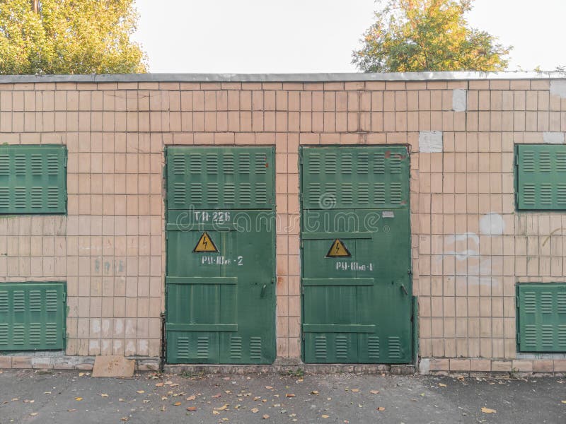 Wall of an Old Soviet Step-down Electrical Substation with a Green Door ...