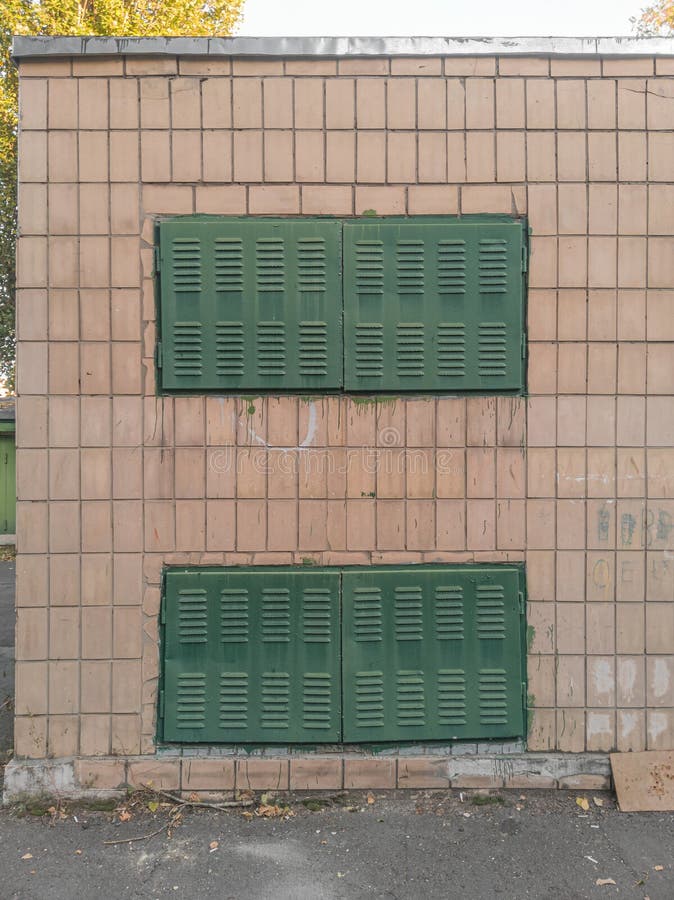 The Wall of the Old Soviet Step-down Electrical Substation with Green ...