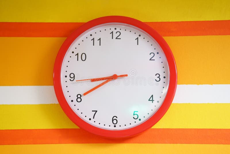 Wall Orange Clock on Colorful Stock Photo - Image of room, dial: 84125360