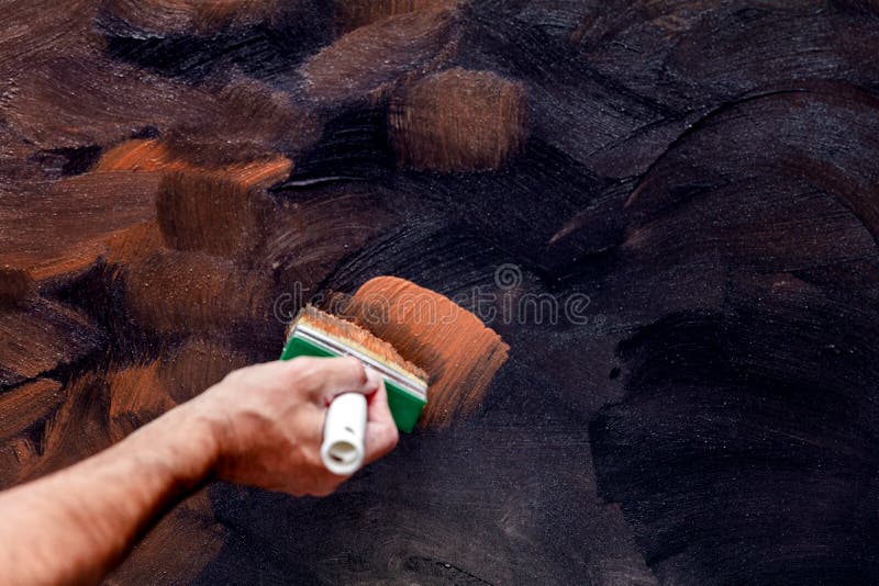 Wall is Painted with a Rust Effect Paint by a Man Stock Photo - Image ...