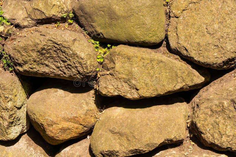 Wall Paved with Large Cobblestones Under Harsh Sunlight. Stock Photo ...