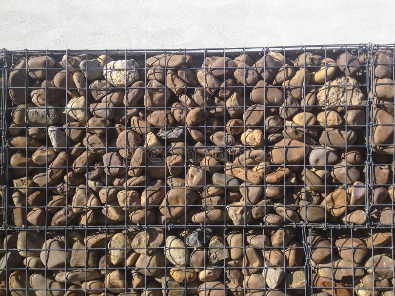 Wall Protected with River Pebble Stones in Iron Mesh Stock Photo ...