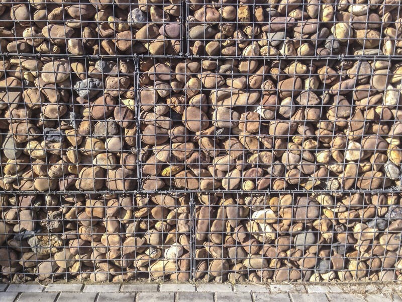 Wall Protected with River Pebble Stones in Iron Mesh Stock Image ...