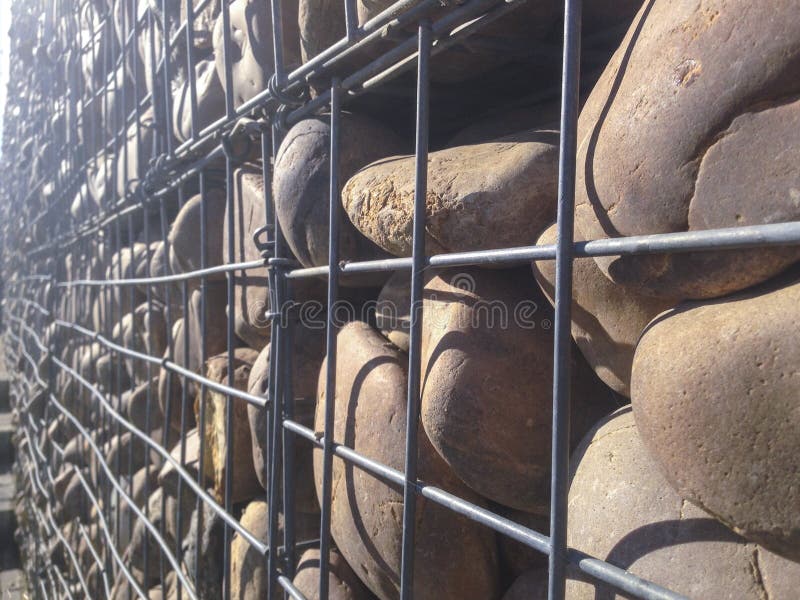 Wall Protected with River Pebble Stones in Iron Mesh Stock Image ...