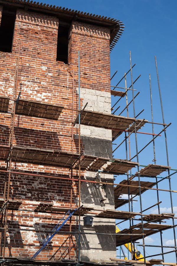 The Wall is Red Brick with a Belt of Limestone Blocks Covered with Moss ...