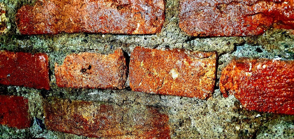 A Wall of Red Bricks, Rectangular, of Varying Sizes, Large and Small ...