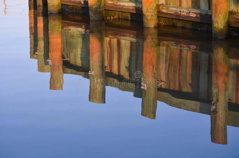 Reflections on Water at Sunset on the Beach As Waves Break on the Sand ...