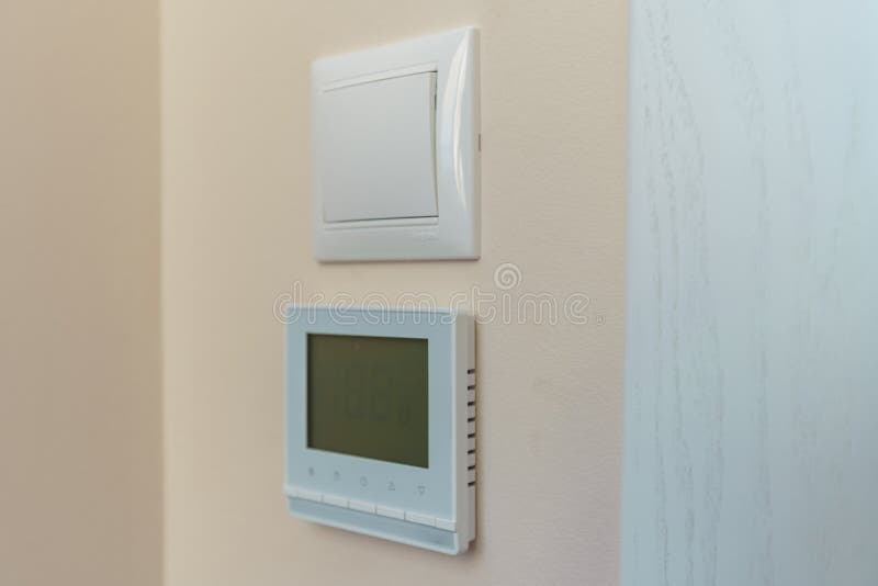 On the Wall of the Room There is a Light Switch and Under it a Floor ...