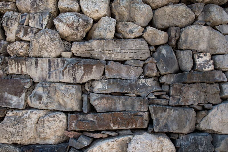 A Wall of Rough Rough Stones. Background of Stones Stock Photo - Image ...