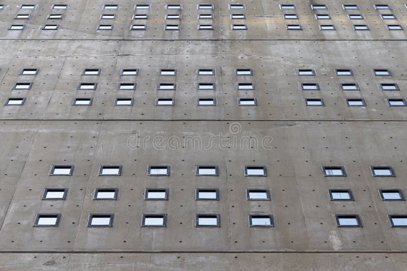 Wall with Small Windows of a Concrete Building Stock Photo - Image of ...