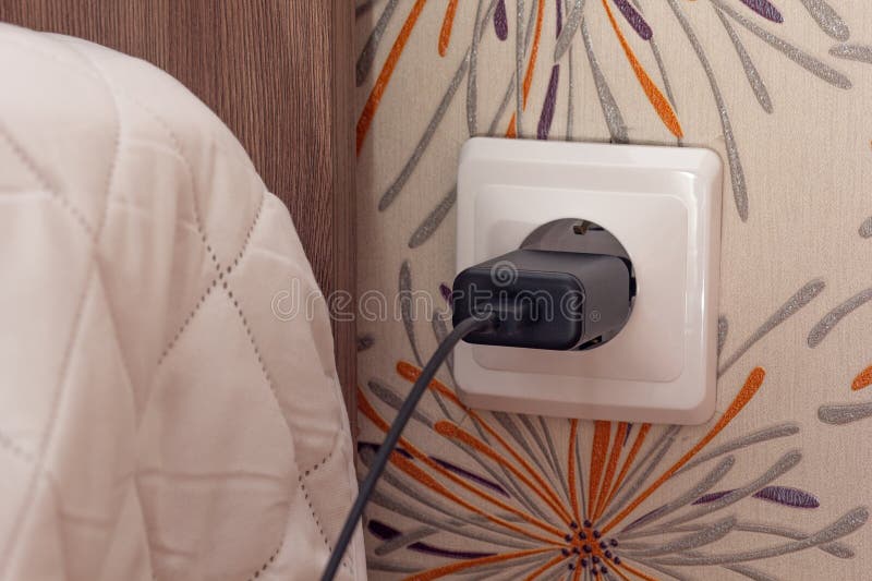 Wall Socket with Charger Plug Inside Close To Bed Stock Image - Image ...