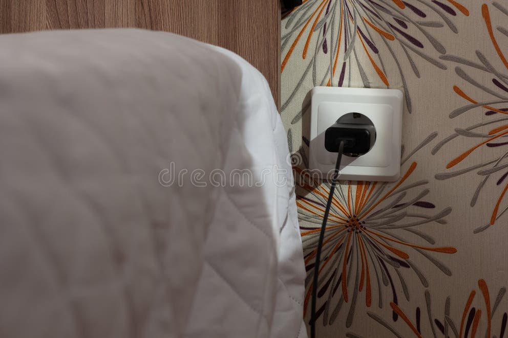 Wall Socket with Charger Plug Inside Close To Bed Stock Image - Image ...