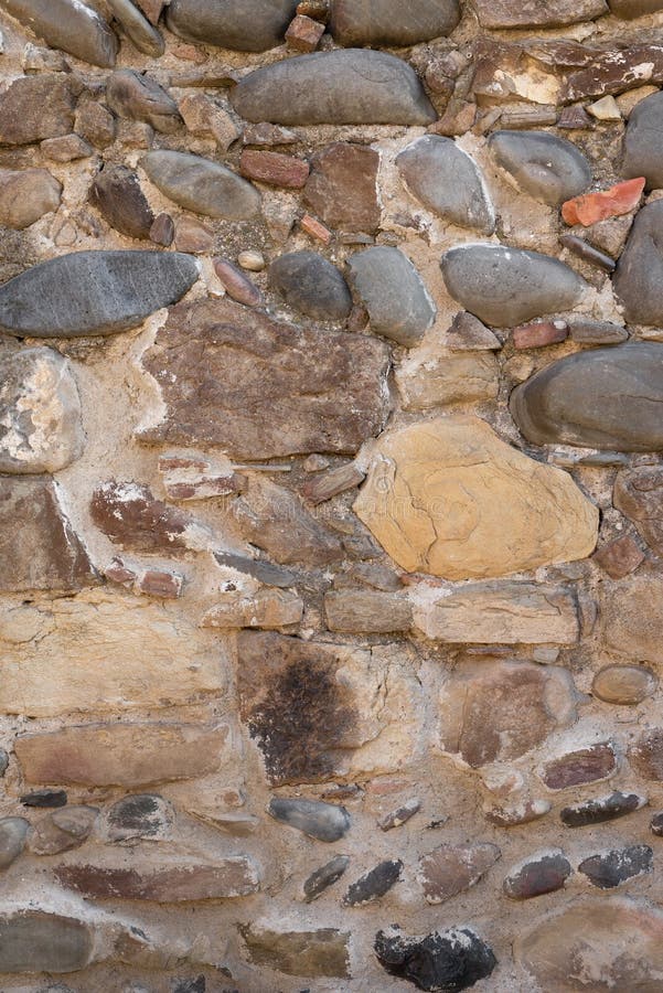 Wall Structure Which Consists of Stones of Different Sizes. Stock Photo ...