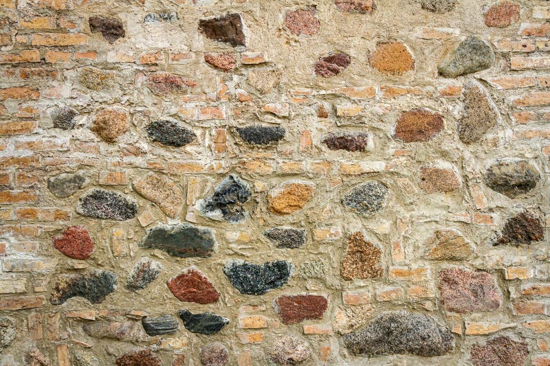 Wall Texture with Pieces of Old Bricks Mixed with Exposed Round Stones ...