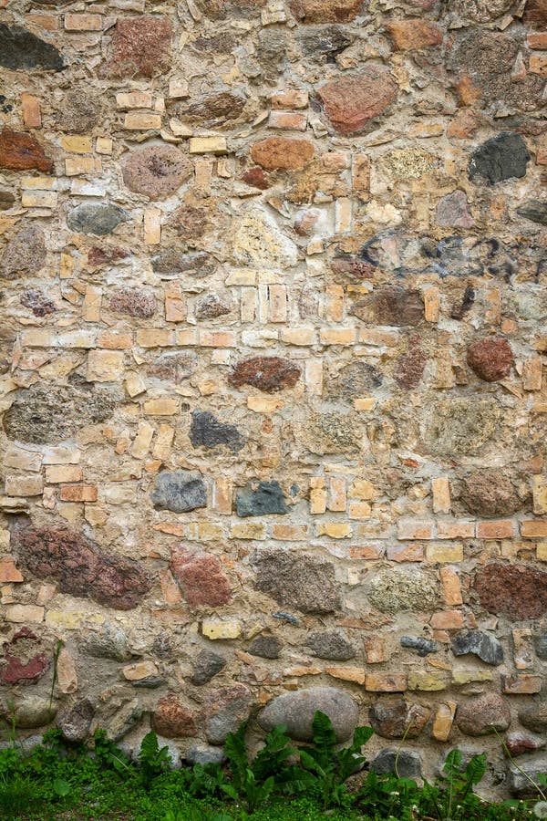 Wall Texture with Pieces of Old Bricks Mixed with Exposed Round Stones ...