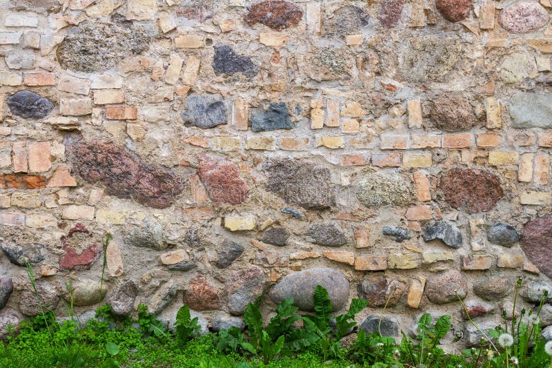 Wall Texture with Pieces of Old Bricks Mixed with Exposed Round Stones ...