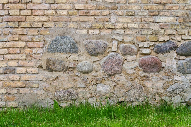 Wall Texture with Pieces of Old Bricks Mixed with Exposed Round Stones ...