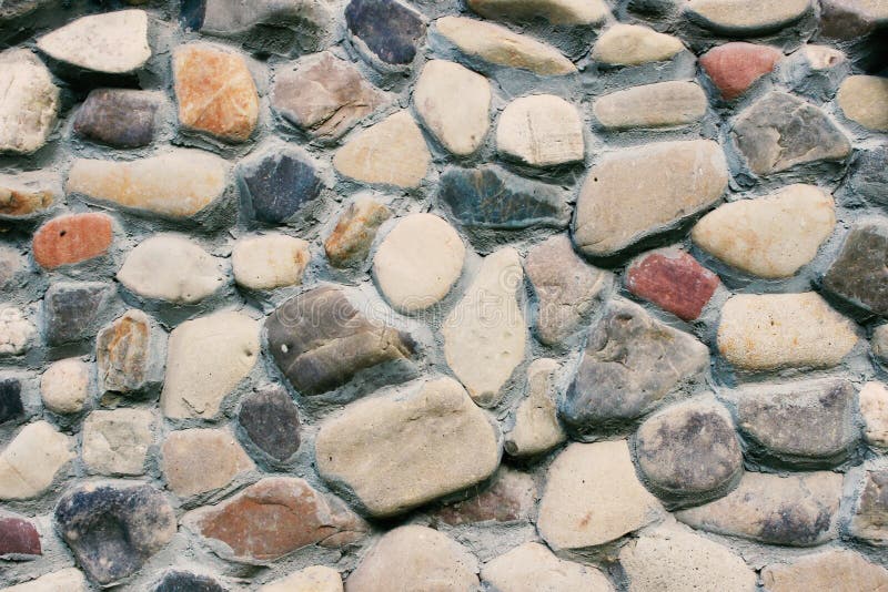 Wall Texture of Round Rocks Brick Background Stock Photo - Image of ...