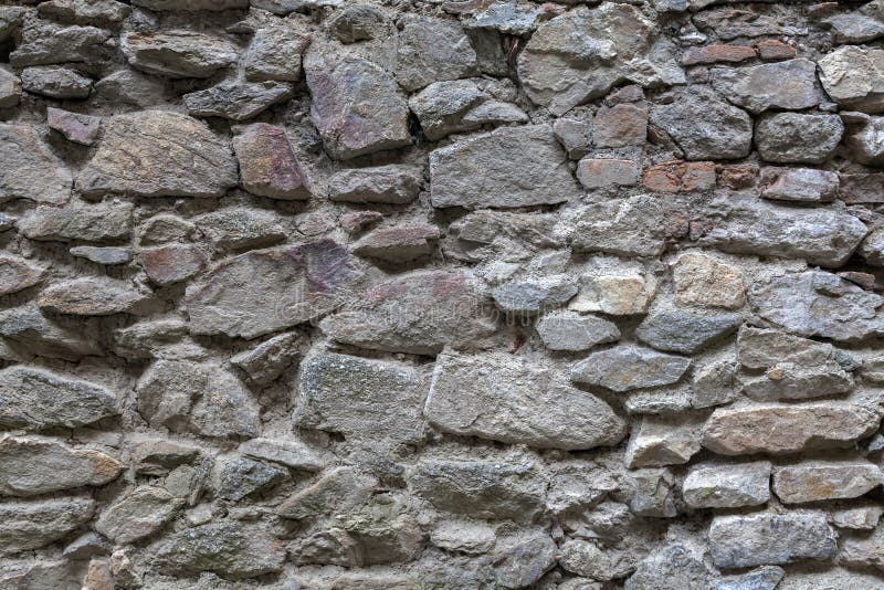 Wall with Textured Stone Blocks Stock Photo - Image of aging, rough ...