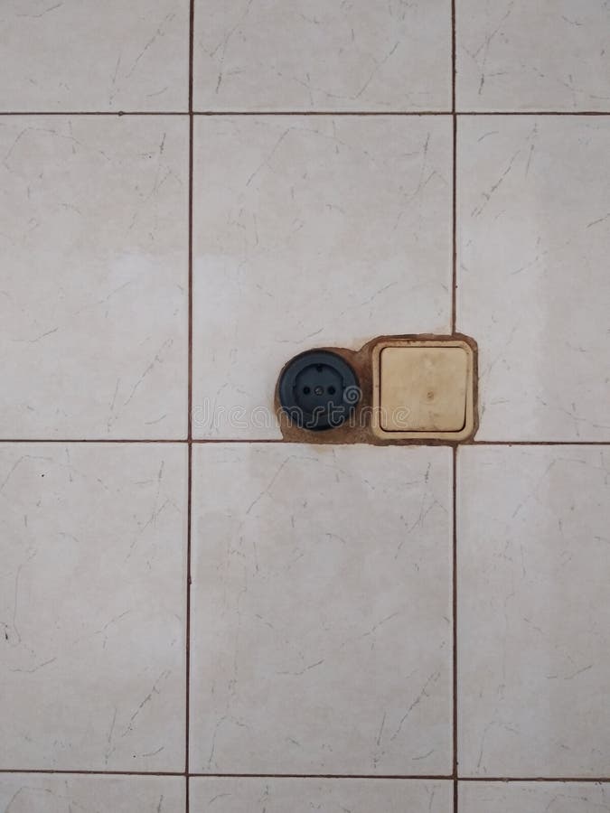 A Wall with Tiles with an Old Electric Switch and Socket, for Texturing ...