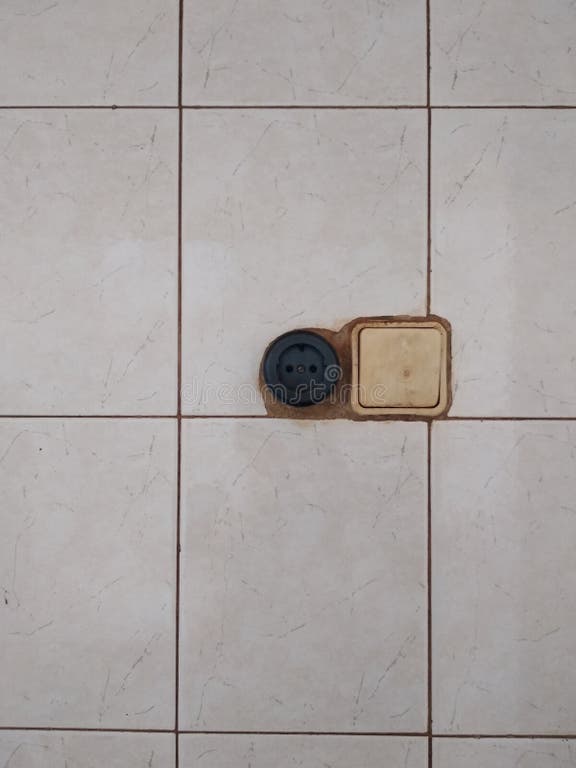 A Wall with Tiles with an Old Electric Switch and Socket, for Texturing ...