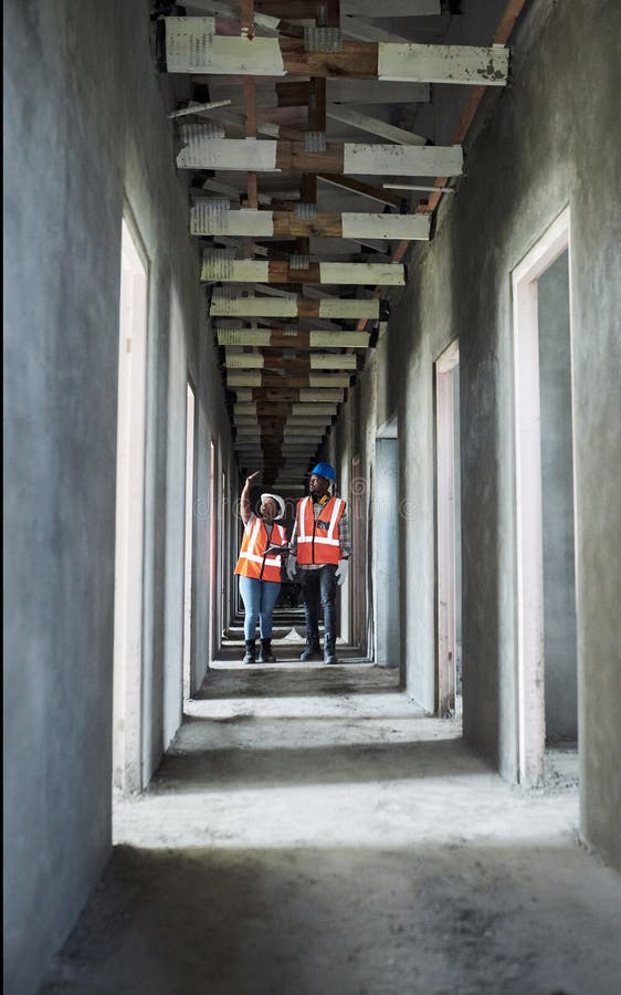 Wall To Wall Exceptional Work. a Young Man and Woman Using a Digital ...
