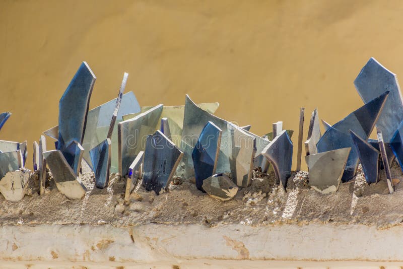 Wall Topped with Sharp Shards for the Protection Against Intrude Stock Photo - Image of glass ...