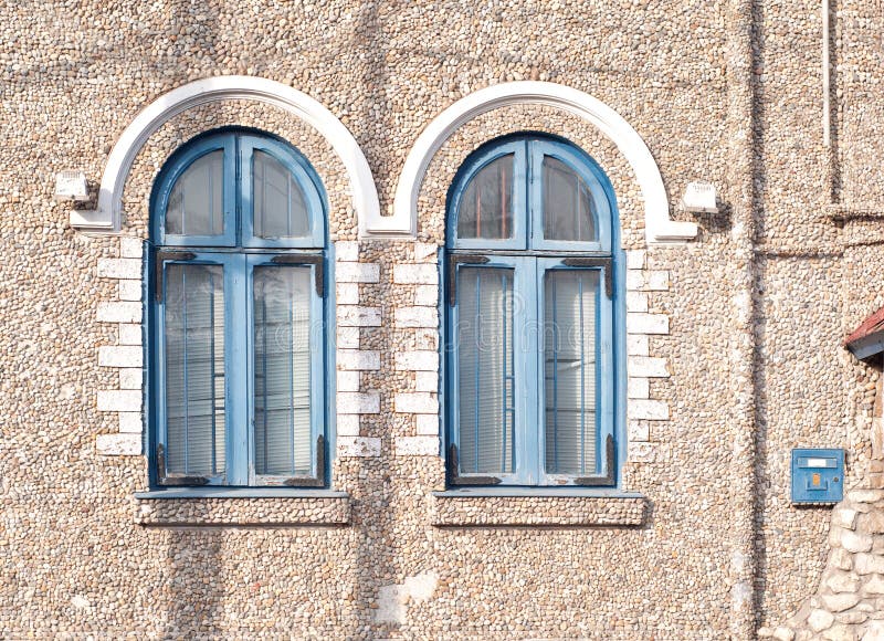Wall with two blue windows stock image. Image of facade - 37283297