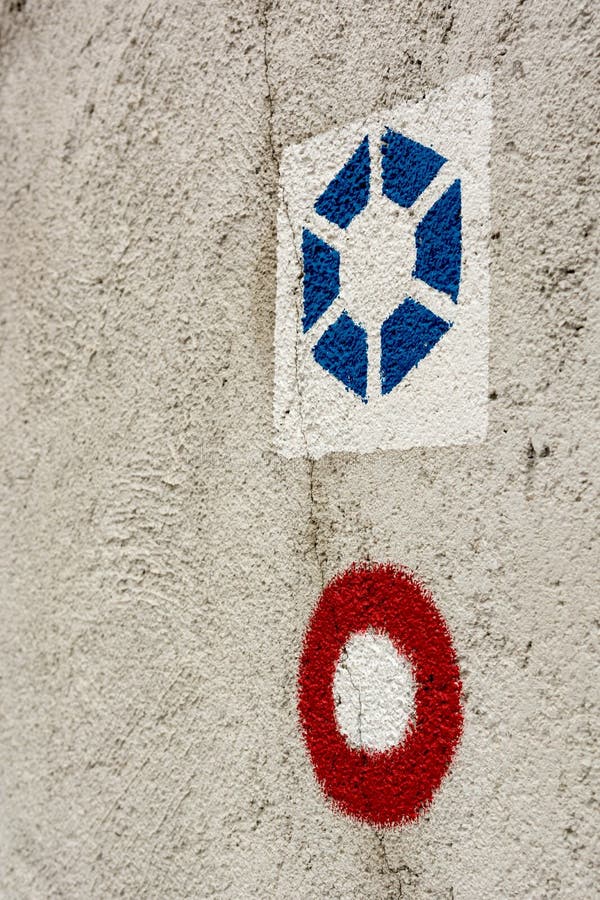 Wall with Two Trail Markers Stock Image - Image of symbol, route: 40644439