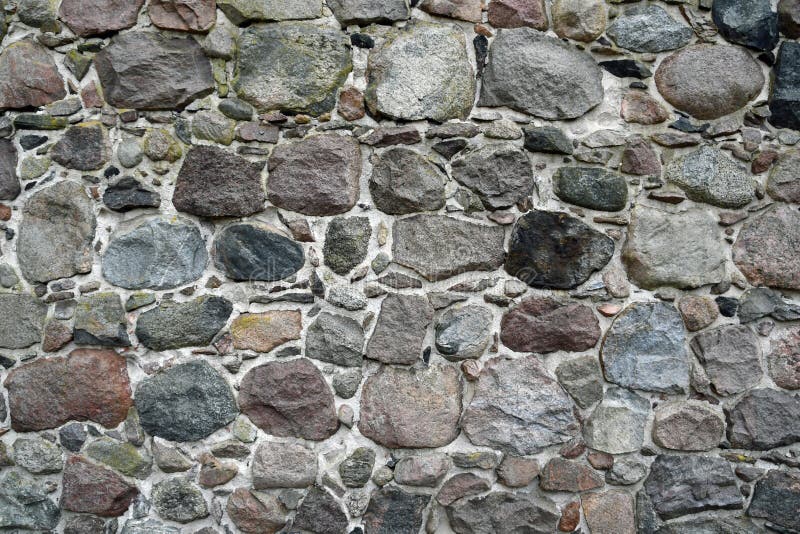 Wall of Unregular Round Shaped Granite Blocks Stock Photo - Image of ...