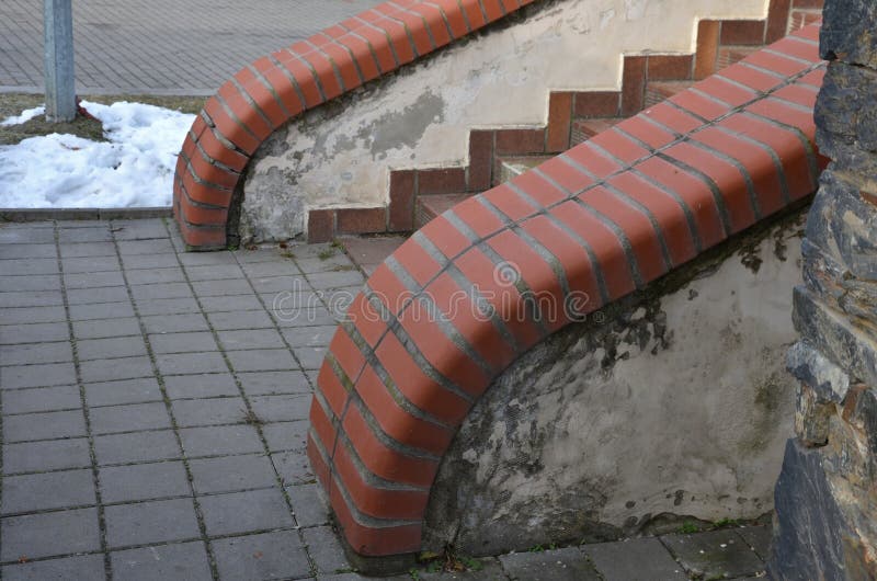 Wall with an Upper Edge Made of Atypical Rounded Fired Bricks. Street ...