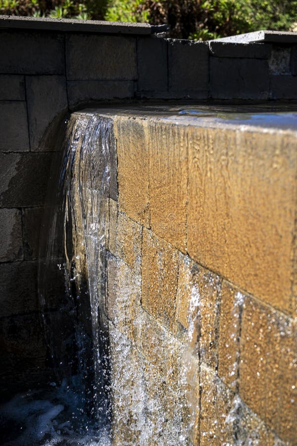 A Wall with a Water Feature on it. Stock Photo - Image of canary, space ...