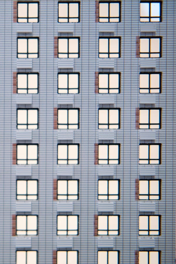 Wall of a White Building with Luminous Windows, Background. Closeup of ...
